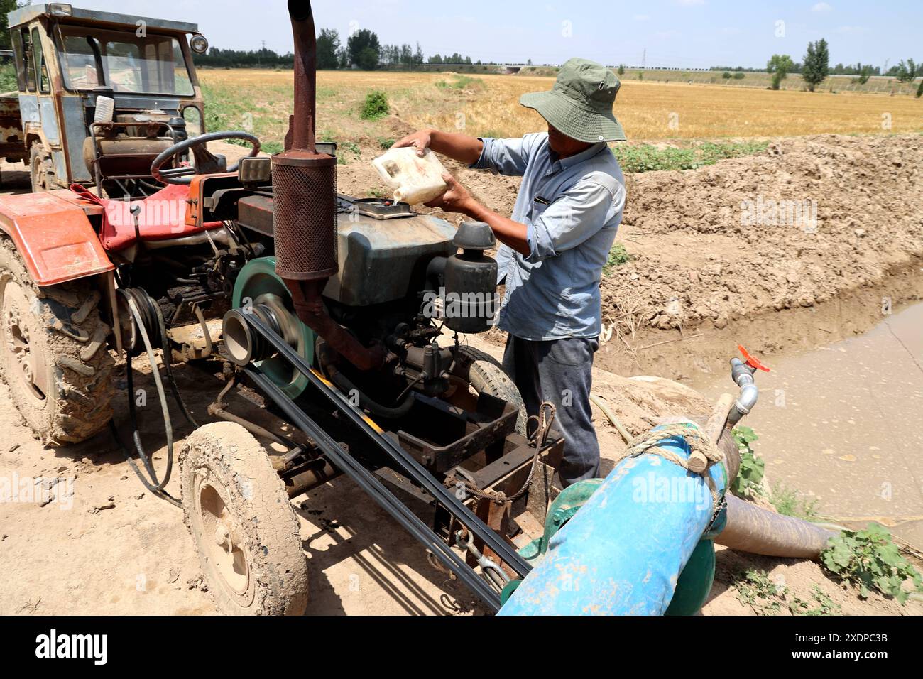 BINZHOU, CHINA - JUNE 24, 2024 - A farmer pumps water from the Yellow ...