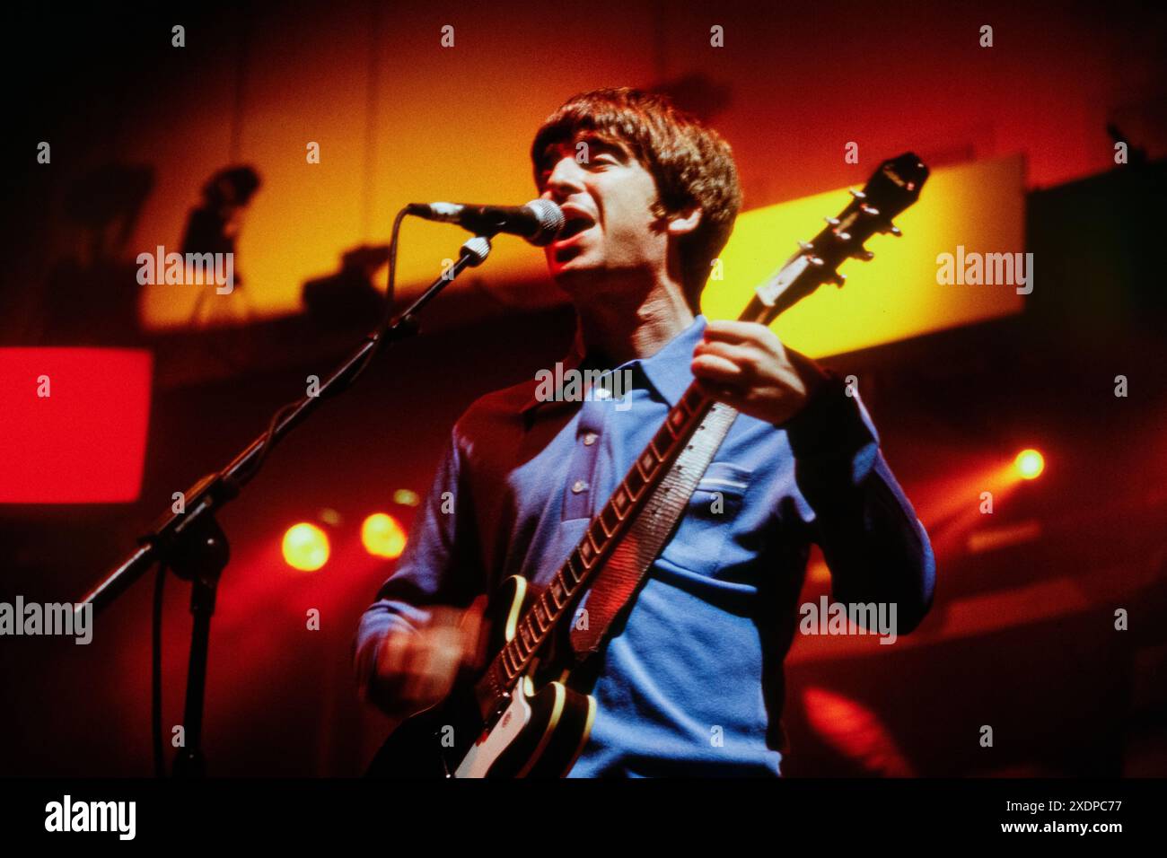 OASIS, MORNING GLORY TOUR, 1996: Noel Gallagher of Oasis playing an ...