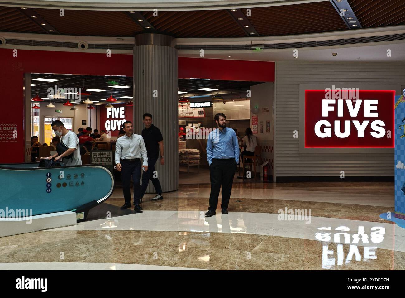 SHANGHAI, CHINA - JUNE 24, 2024 - Tourists eat at the American fast ...