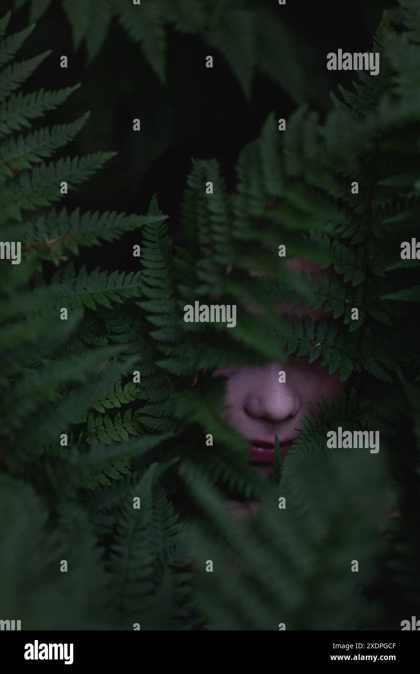 Person hiding plant hi-res stock photography and images - Alamy