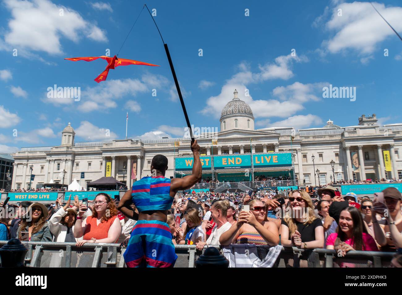 The crowd in Trafalgar Sqaure cheer and sing along at West End Live ...