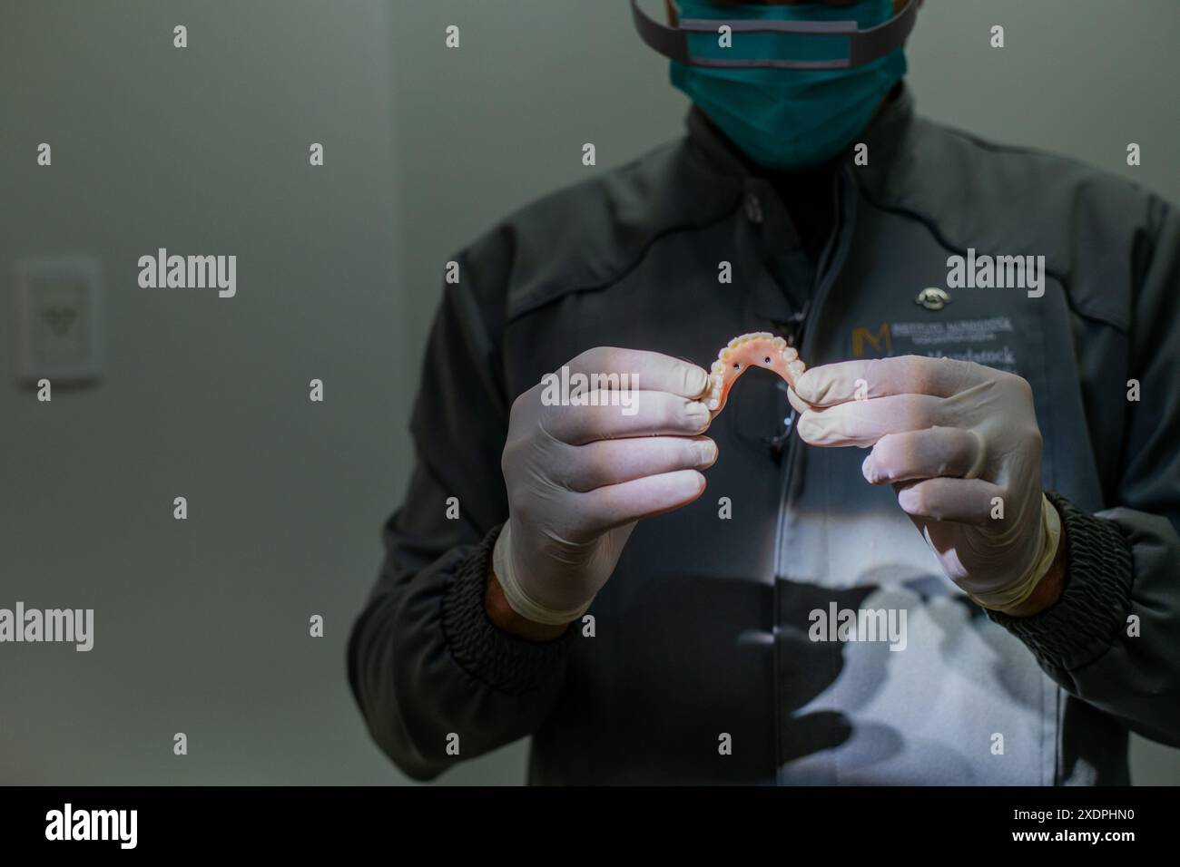 Dental surgeon working on prothesis for teeth replacement Stock Photo ...
