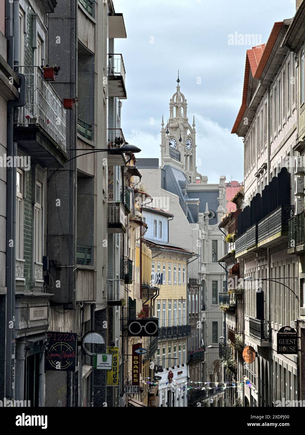 Narrow City Street with Historic Buildings and Clock Tower on a Cloudy ...