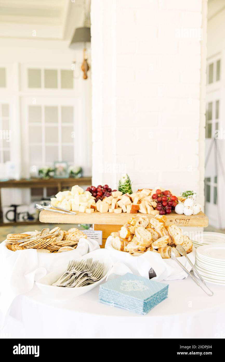 Elegant food display with cheeses, bread, crackers, and fruits Stock ...