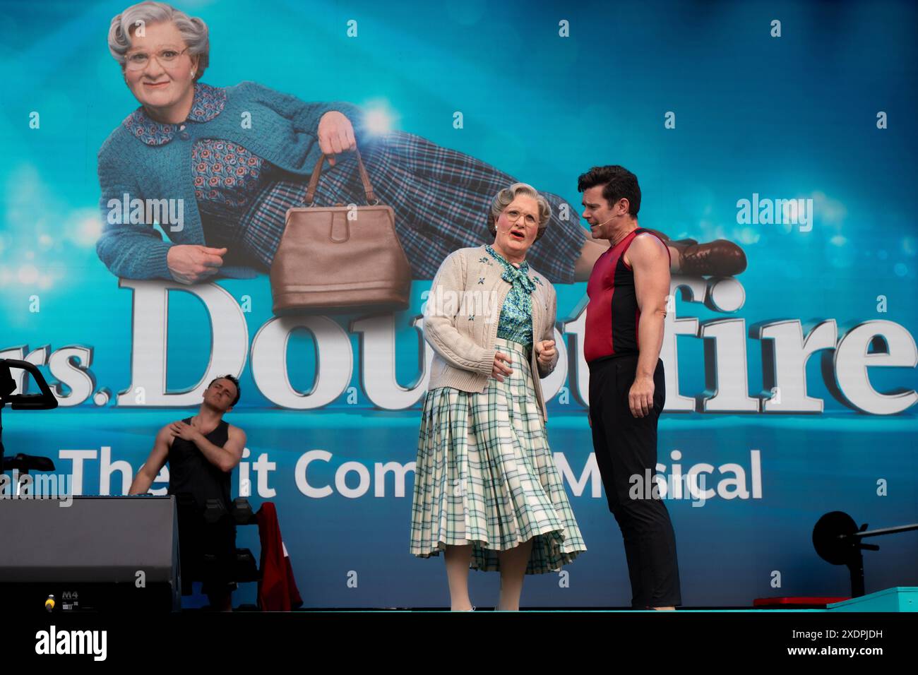 The cast of Mrs Doubtfire the musical perform in costume on stage at West End Live. West End ...
