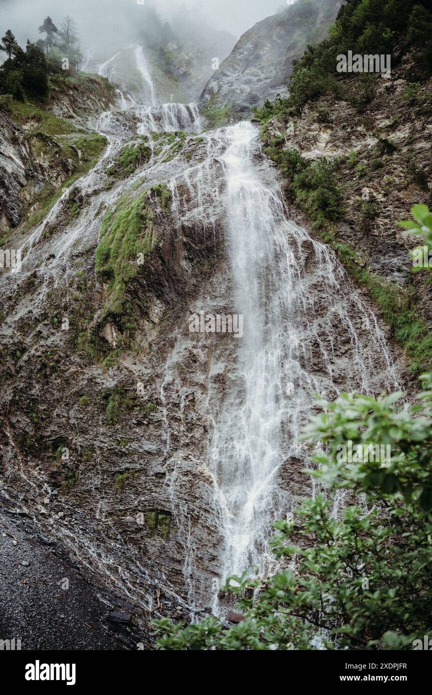Waterfall in rainy Torrent neuf, Wallis, Switzerland Stock Photo - Alamy