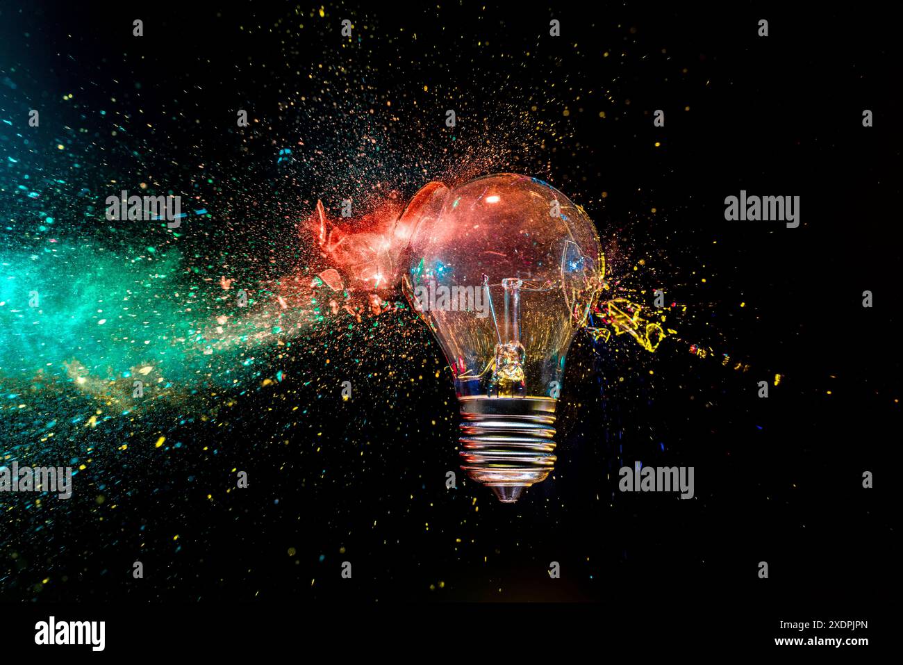 real image Light bulb exploding colorful powder black background ...