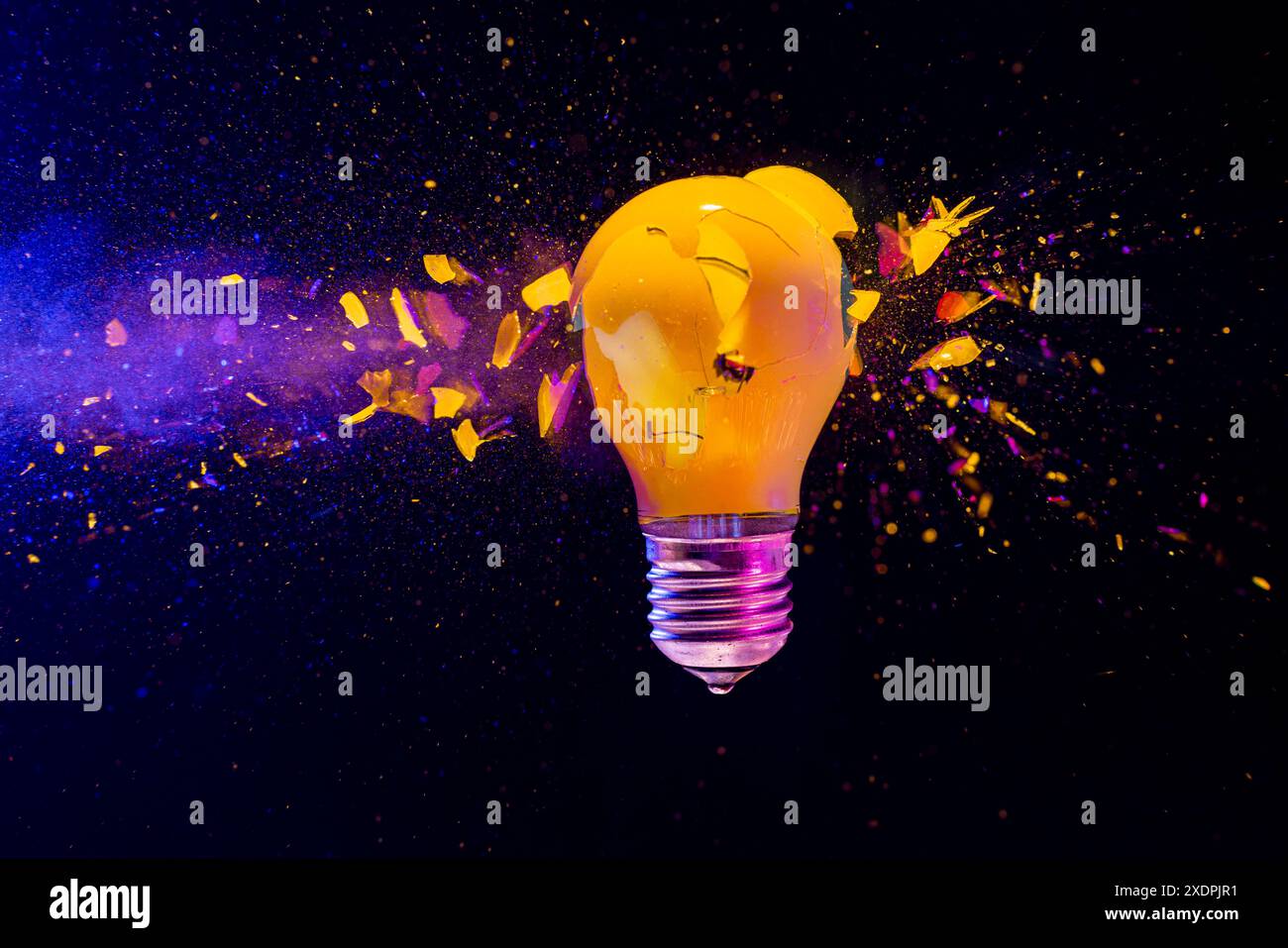 Yellow light bulb exploding black background real high speed image ...