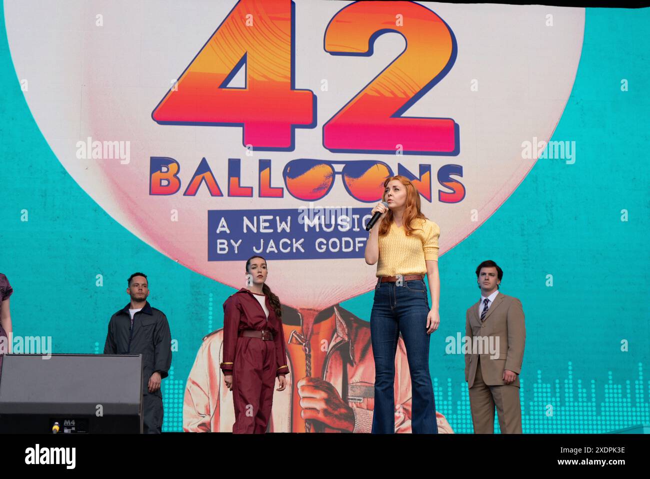 The cast of 42 Balloons perform on stage at West End Live. West End ...