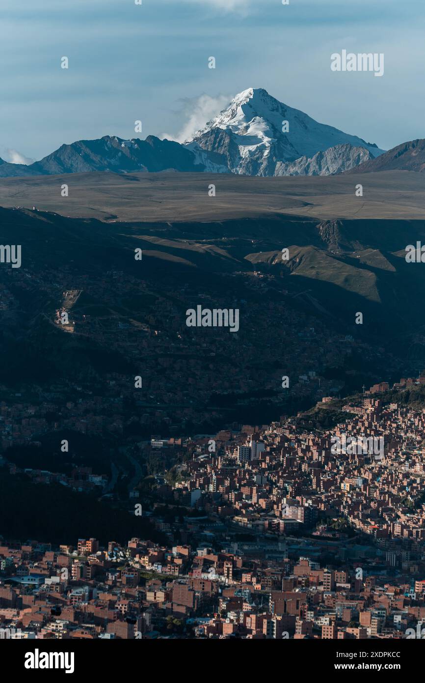 Huayna Potosi snow-capped mountain with the city of La Paz in Bolivia ...