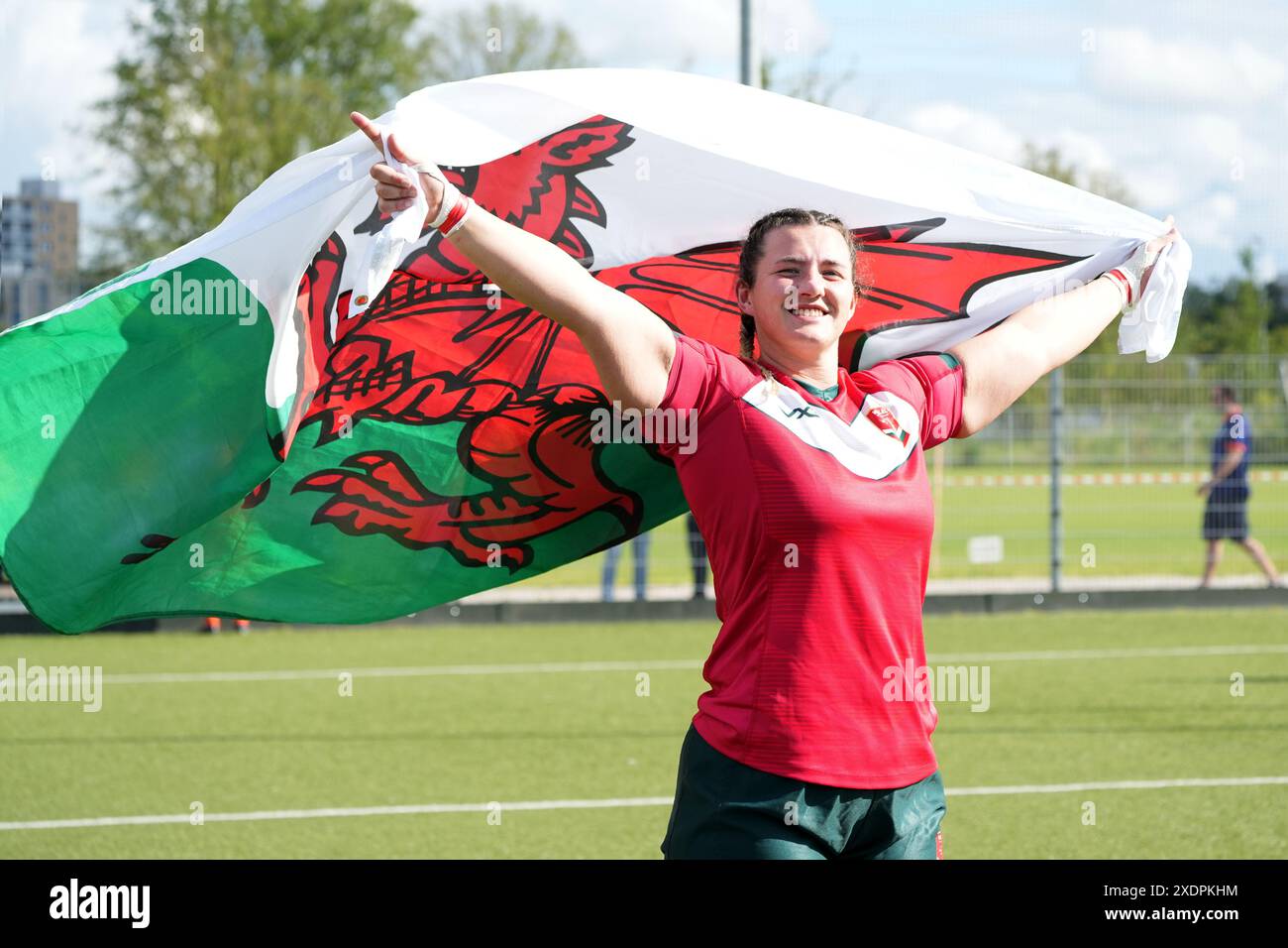 ffion Jenkins with a welsh flag celebrating Wales rugby league's win ...