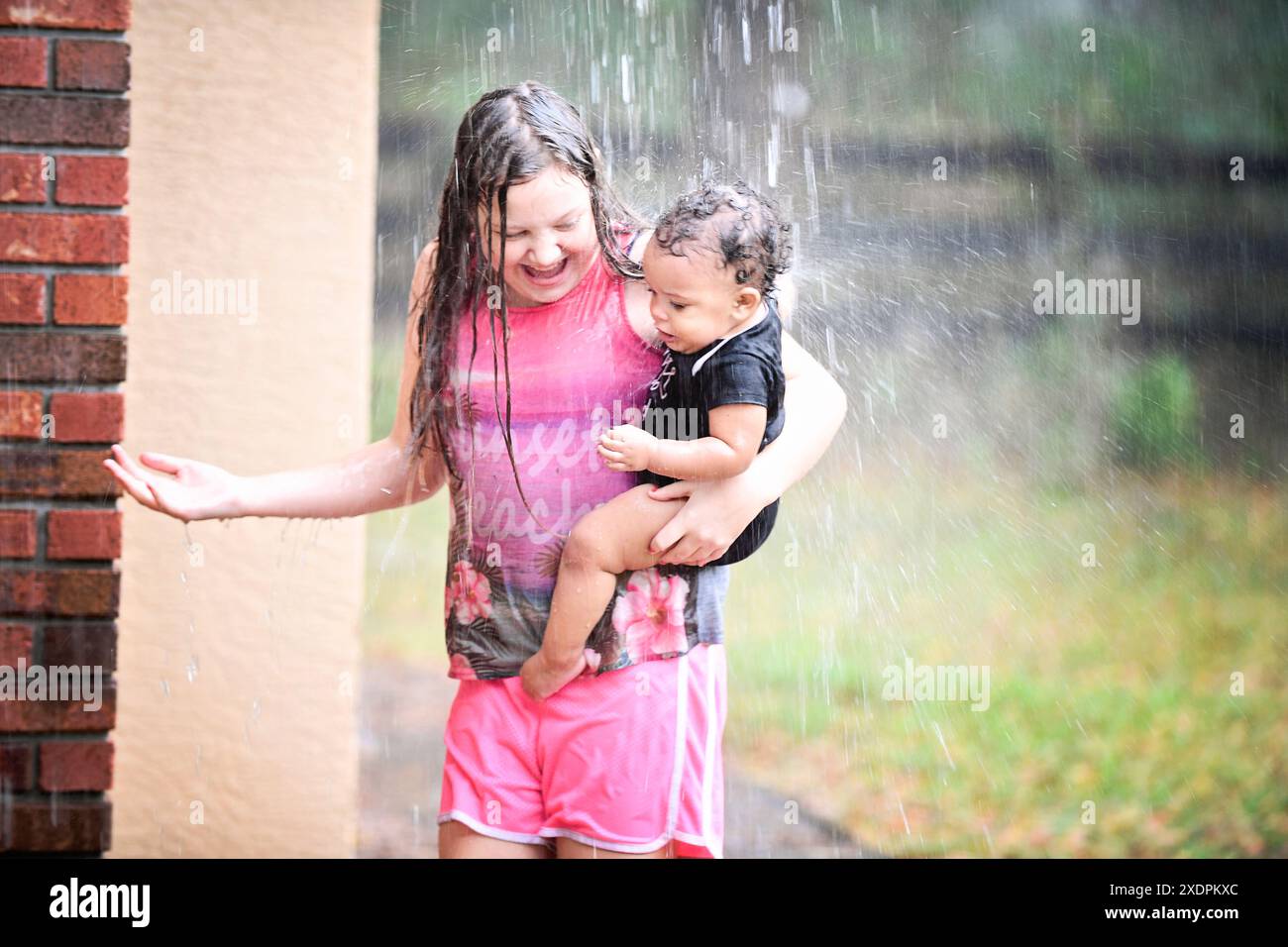 Girl in rain shower hi-res stock photography and images - Alamy