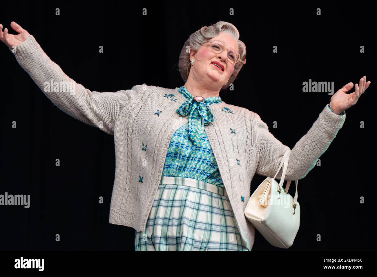 The cast of Mrs Doubtfire the musical perform in costume on stage at ...