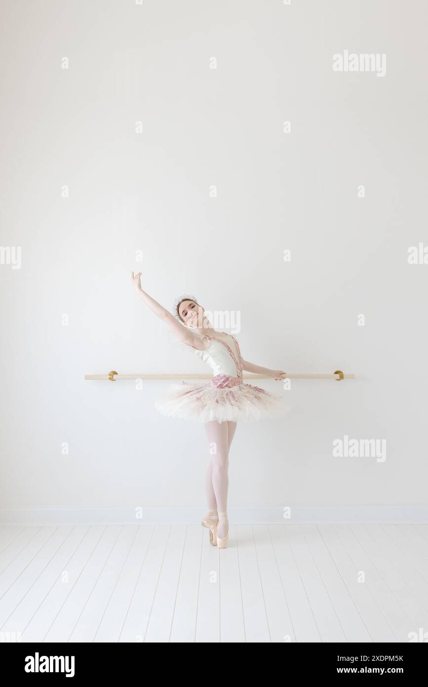 ballerina practices for ballet recital with ballet barre Stock Photo ...