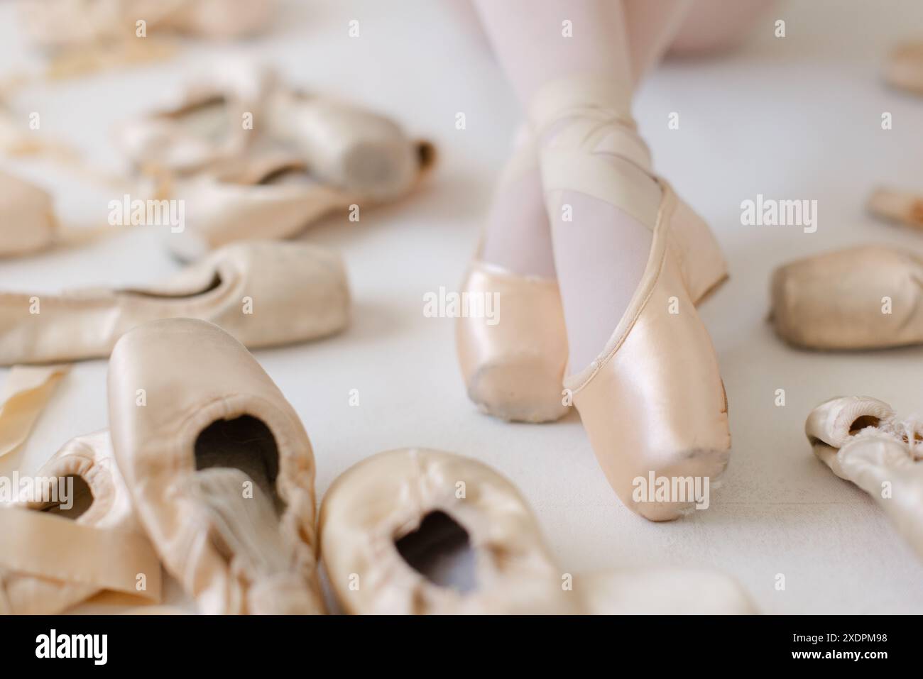 closeup of ballerina's feet in a pile of pointe shoes Stock Photo - Alamy