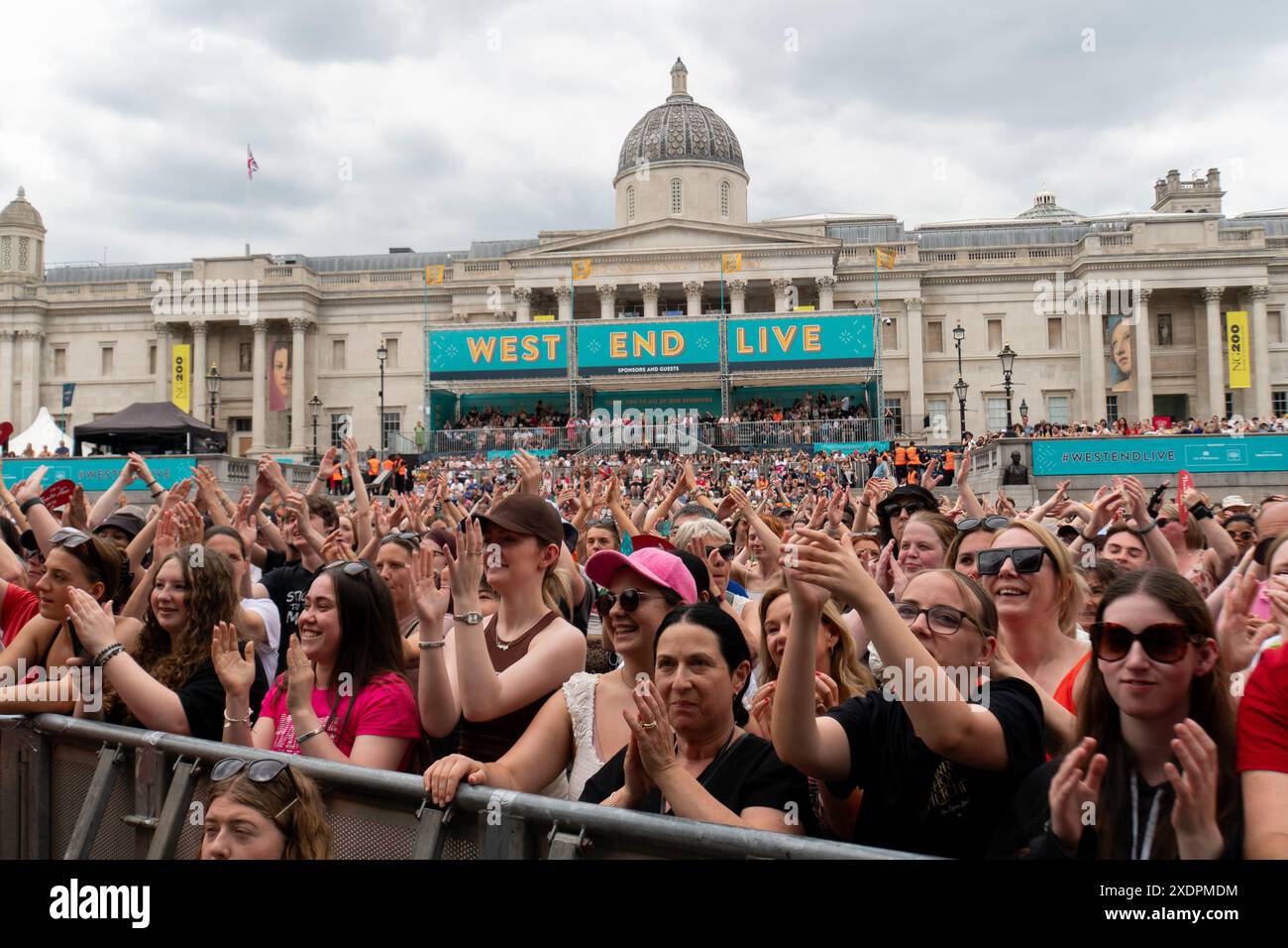 The crowd in Trafalgar Sqaure cheer and sing along at West End Live ...