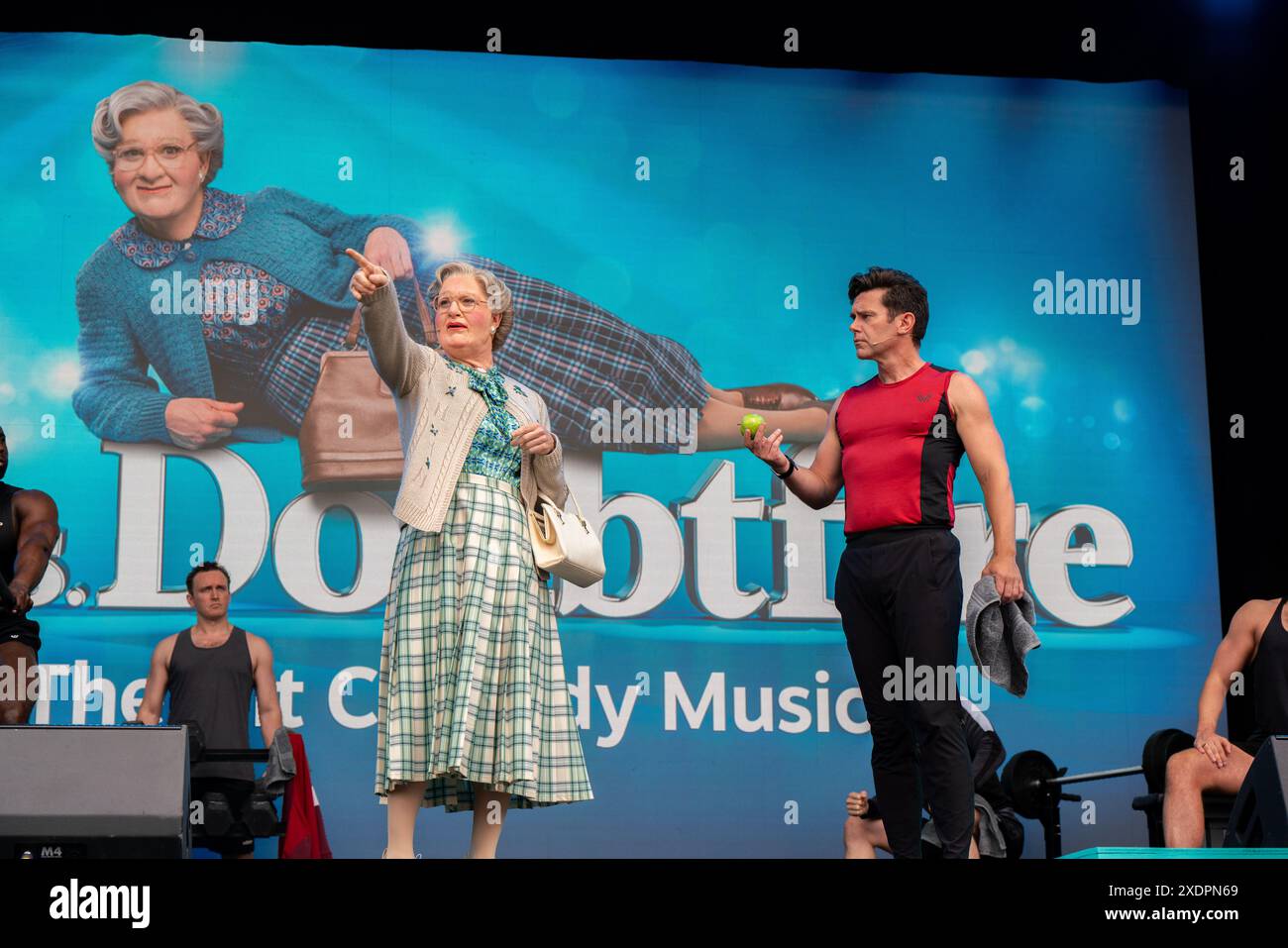 The cast of Mrs Doubtfire the musical perform in costume on stage at ...