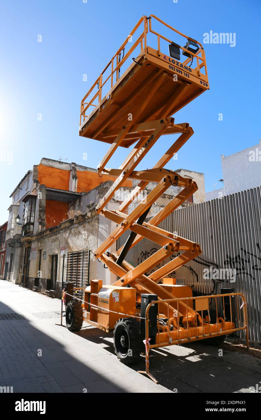 Madrid, Spain- October 23, 2023: Scissor lift platform on the street in ...