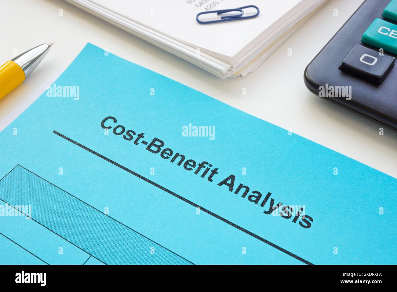 Cost benefit analysis papers and financial report Stock Photo - Alamy