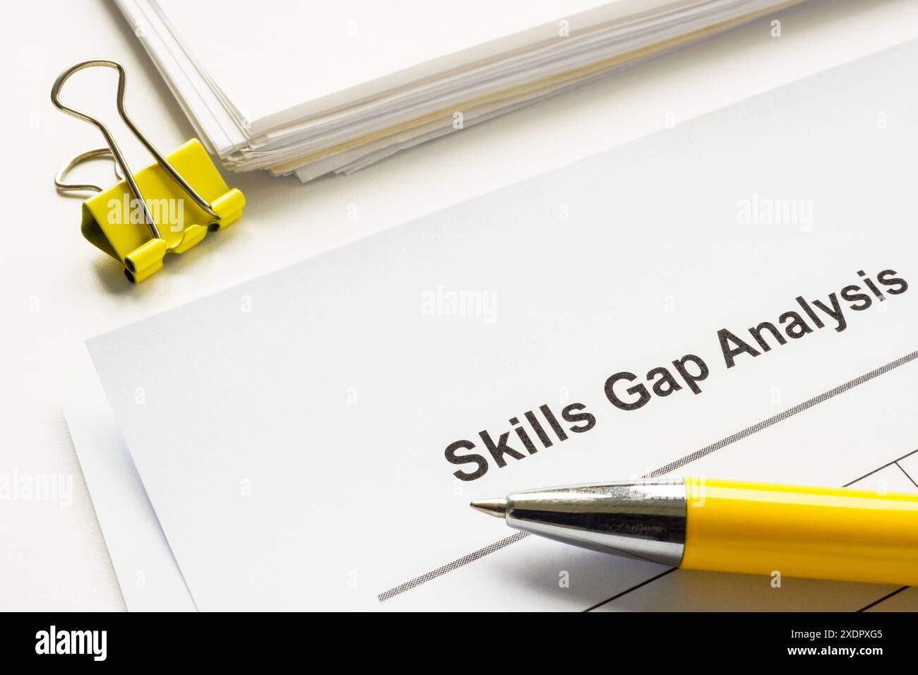 Stack of papers with skills gap analysis Stock Photo - Alamy