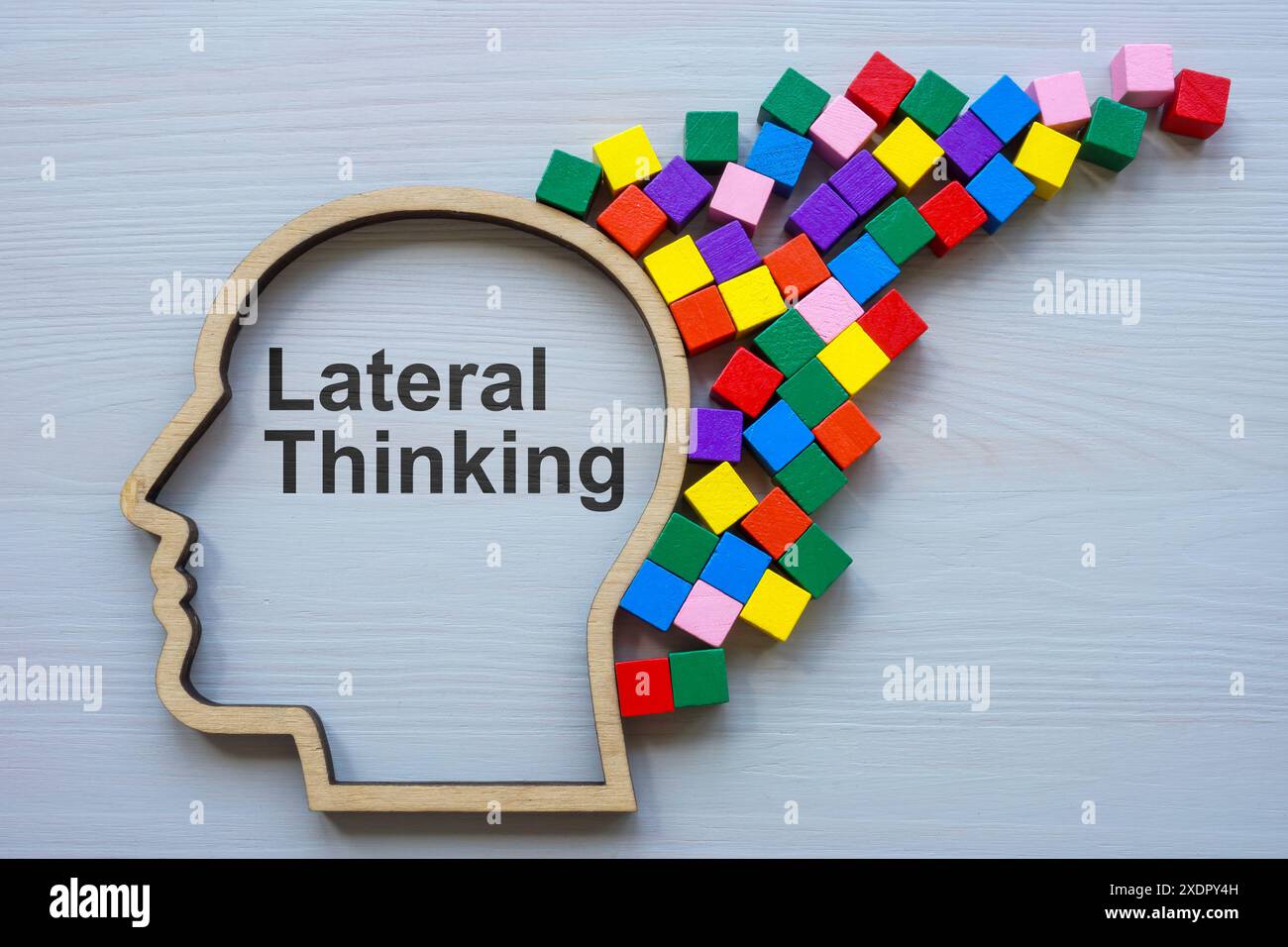 Lateral thinking concept. Head and colored cubes Stock Photo - Alamy
