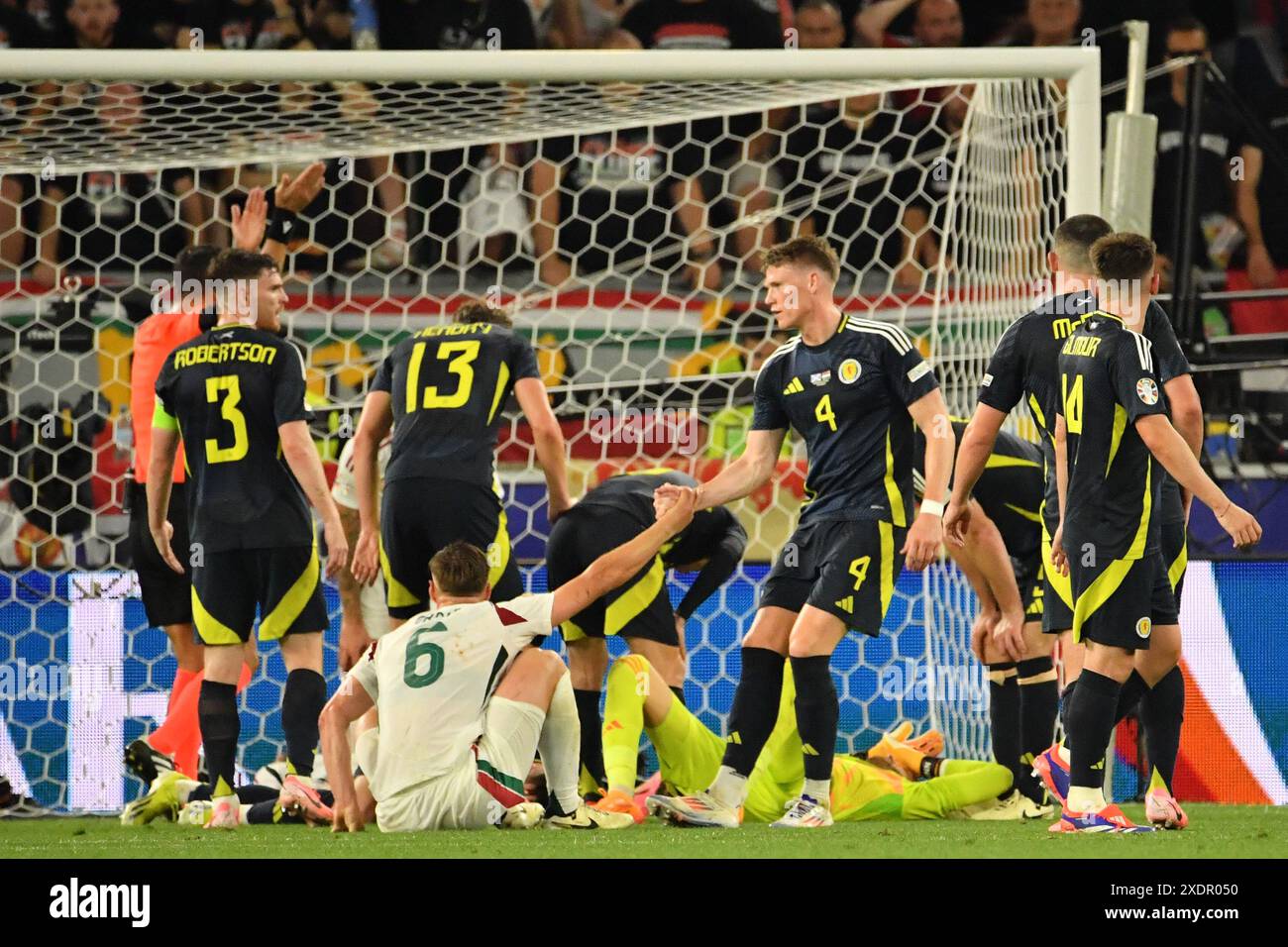 Stuttgart, Germany, 23rd Jun, 2024. Scott McTominay 4 helps Willi Orban ...