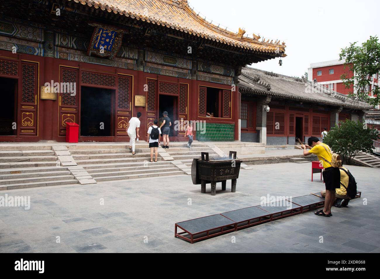 Religious man praying at the Lama temple which is the biggest Tibetan ...