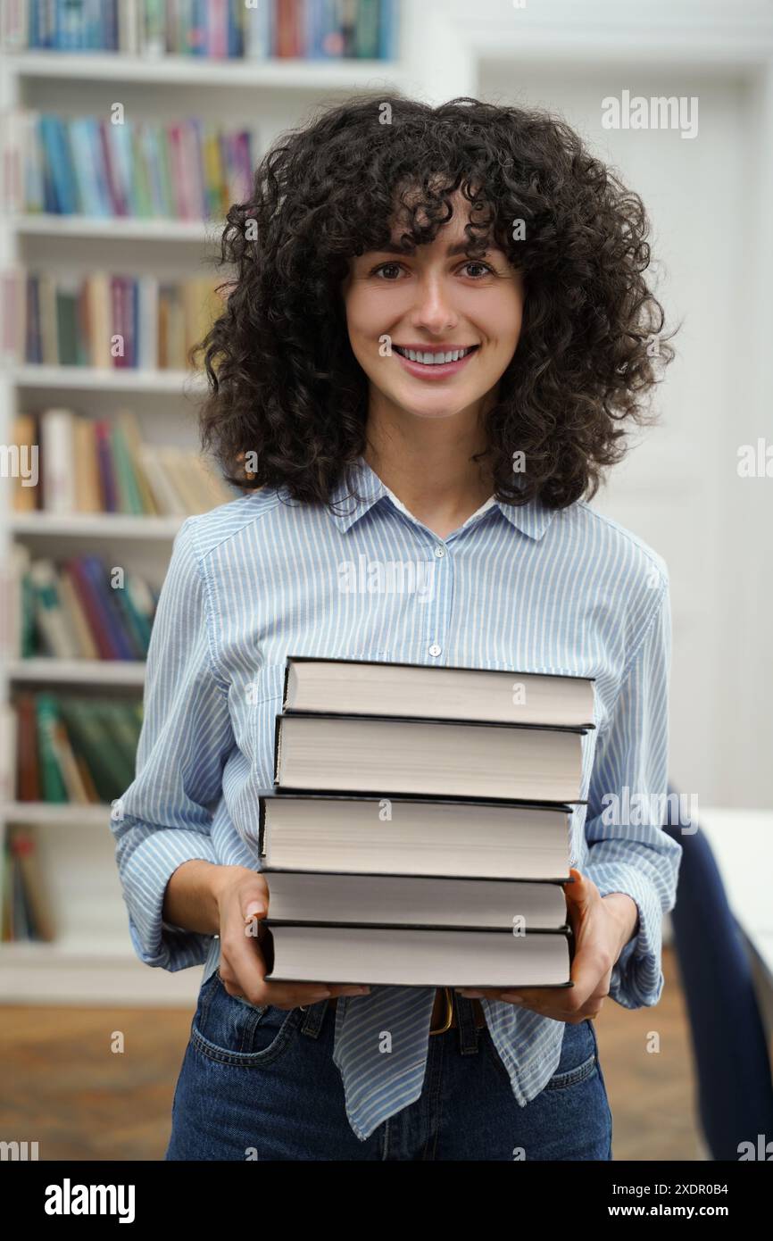 Pretty librarian working in library hi-res stock photography and images ...