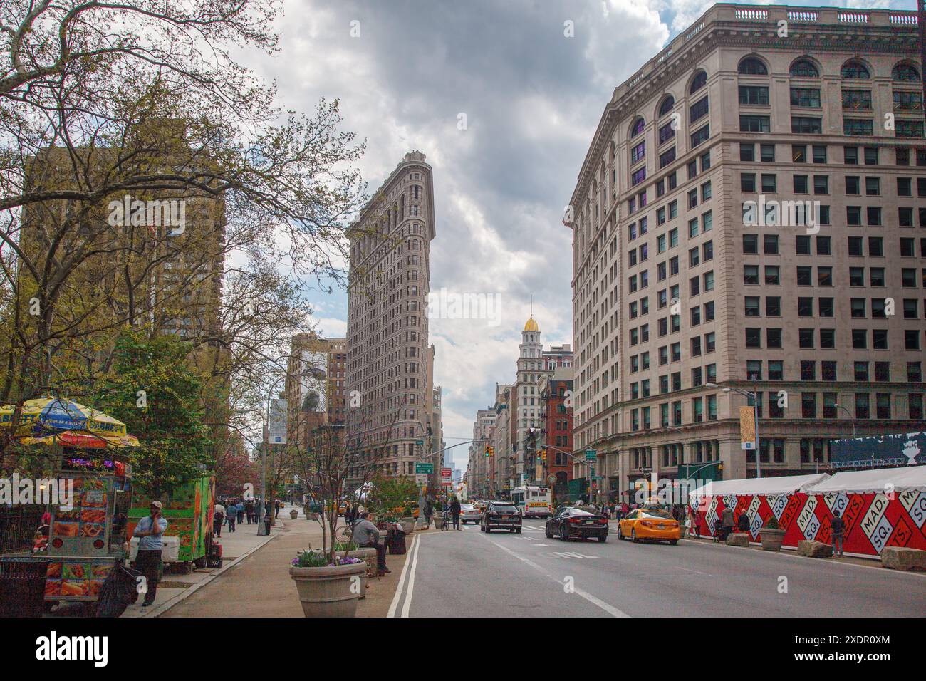 The iconic skyscraper Flatiron building in Madison Square park ...