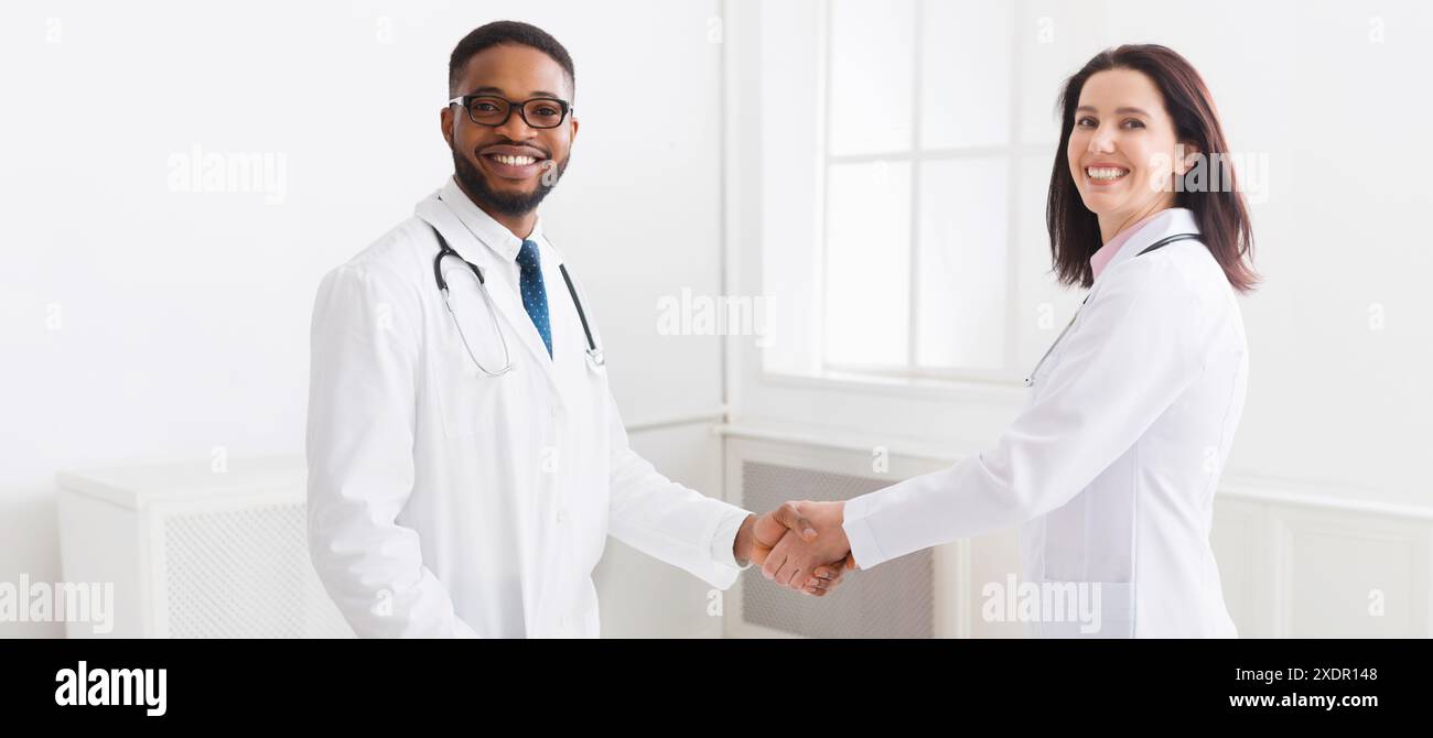Welcome On Board. Diverse Doctors Shaking Hands Stock Photo - Alamy