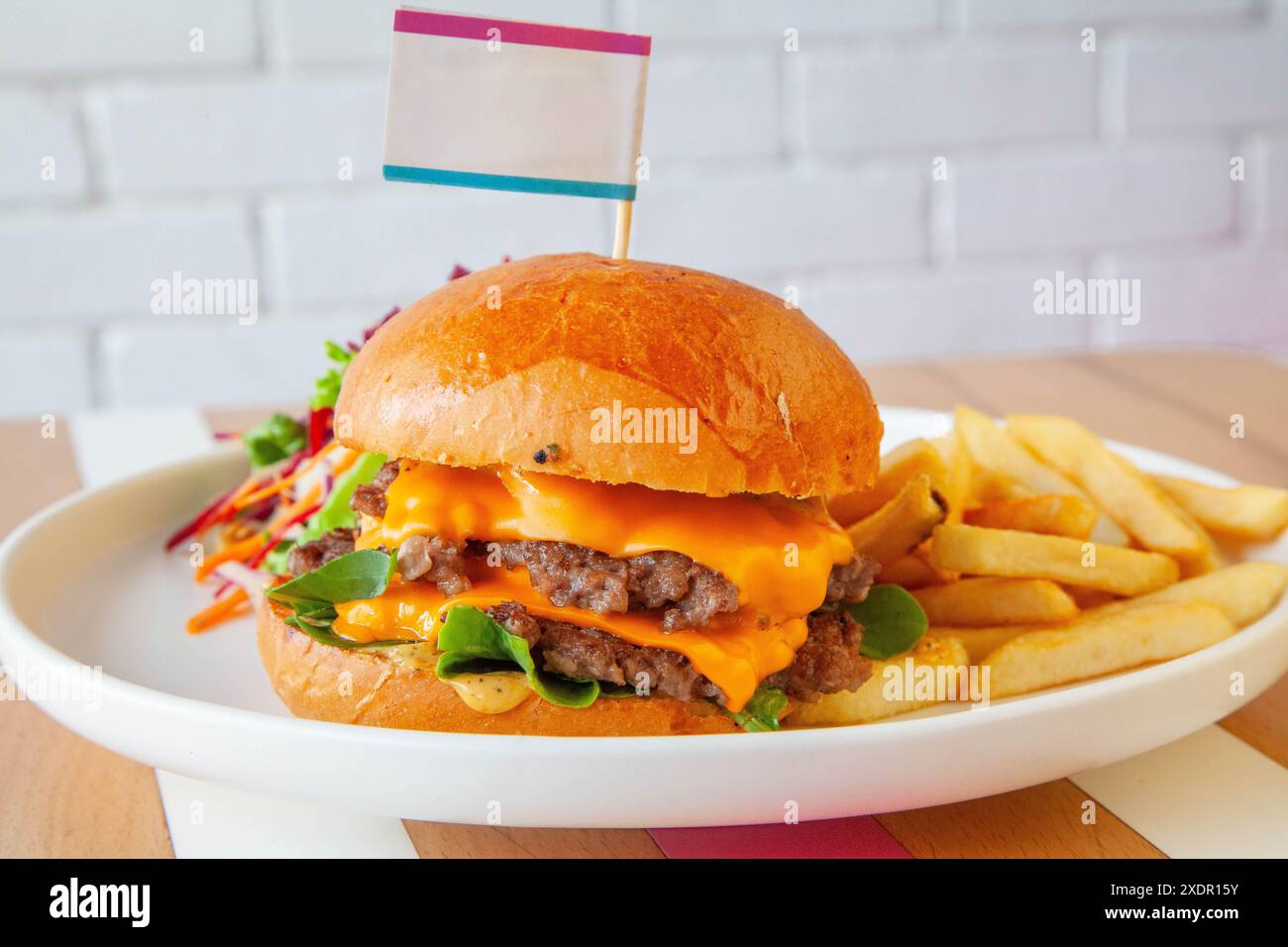 Smashed beef double patty brioche. In burger served with fries and ...