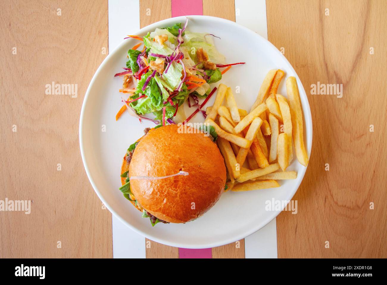 Smashed beef double patty brioche. In burger served with fries and ...