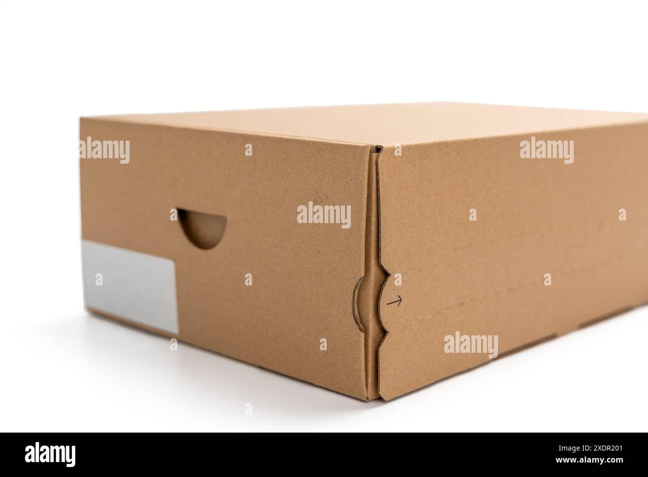 Cardboard box with white sticker. cardboard box on a white background ...