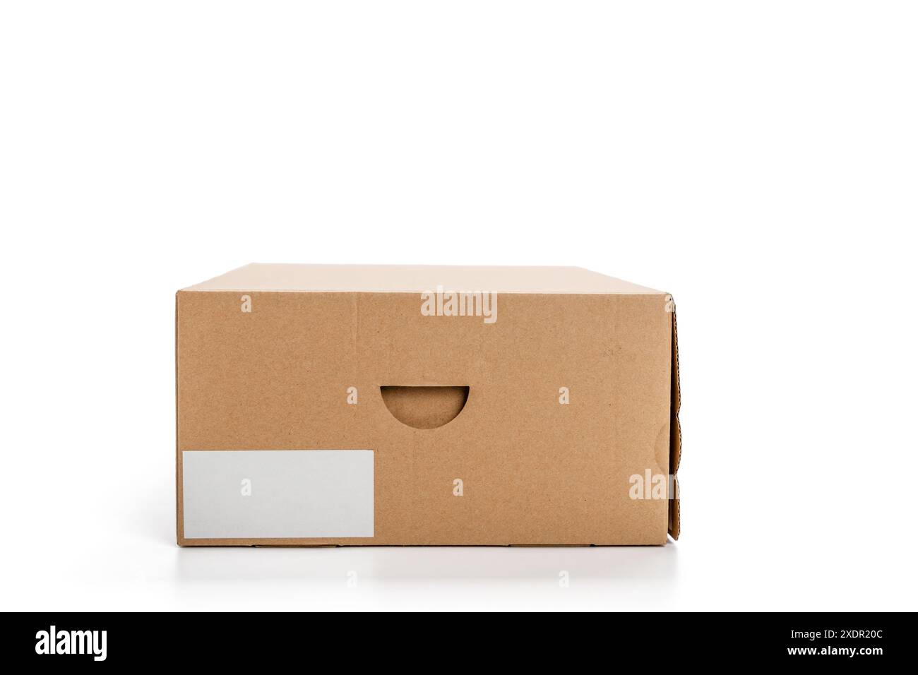 Cardboard box with white sticker. cardboard box on a white background ...