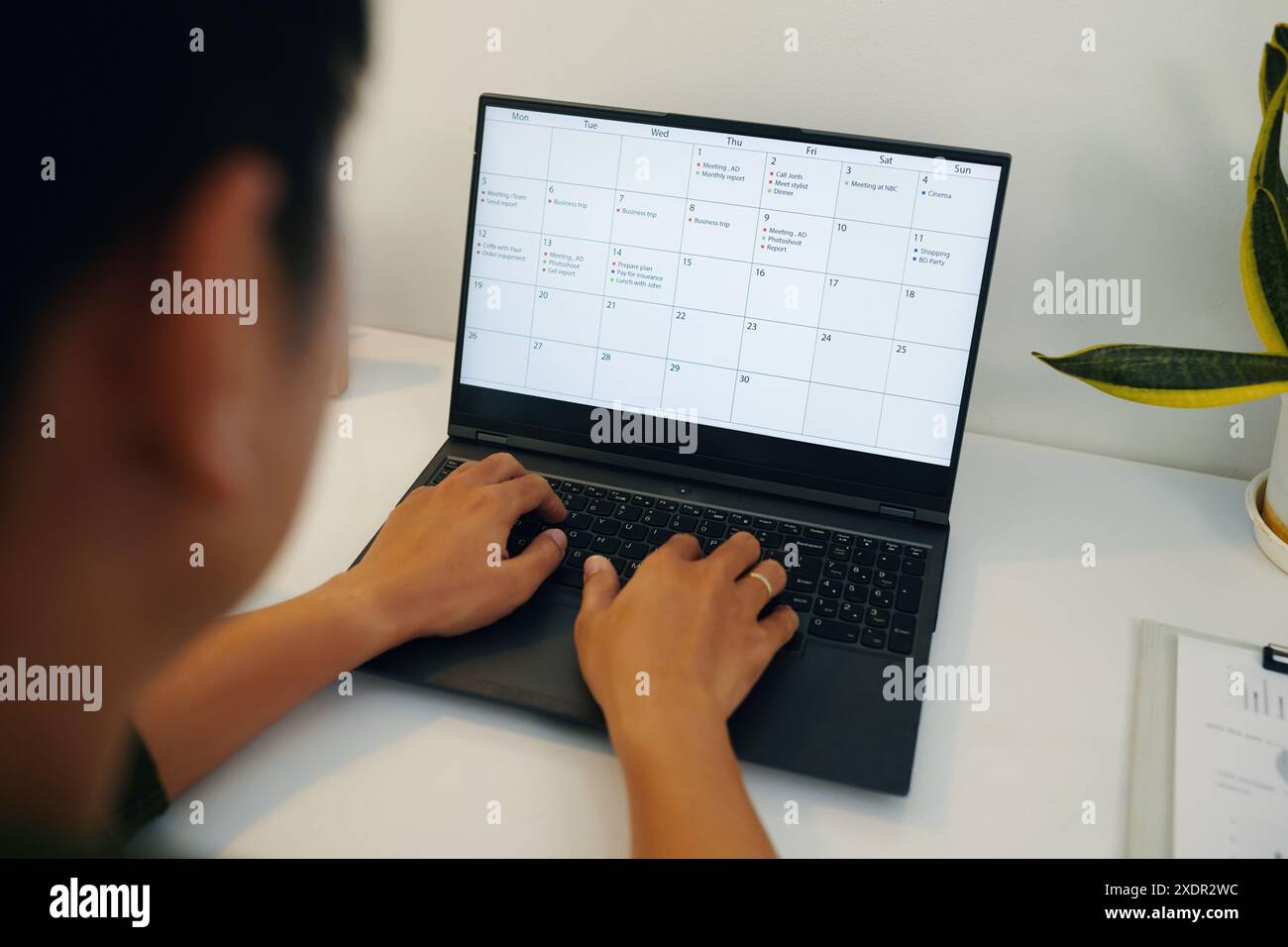 Businessman with timetable in office hi-res stock photography and ...