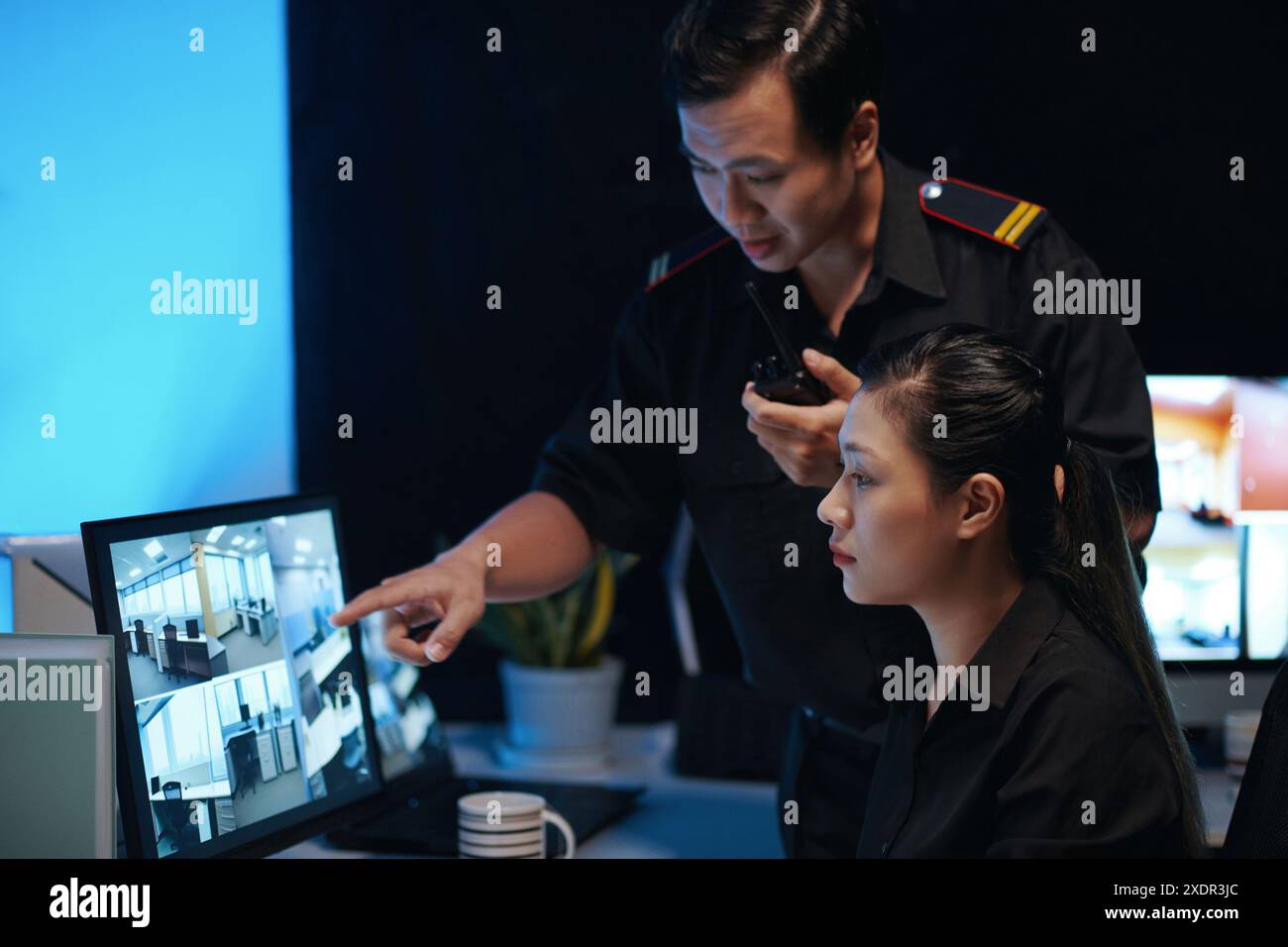 Security Workers Working In Team In Office Stock Photo - Alamy