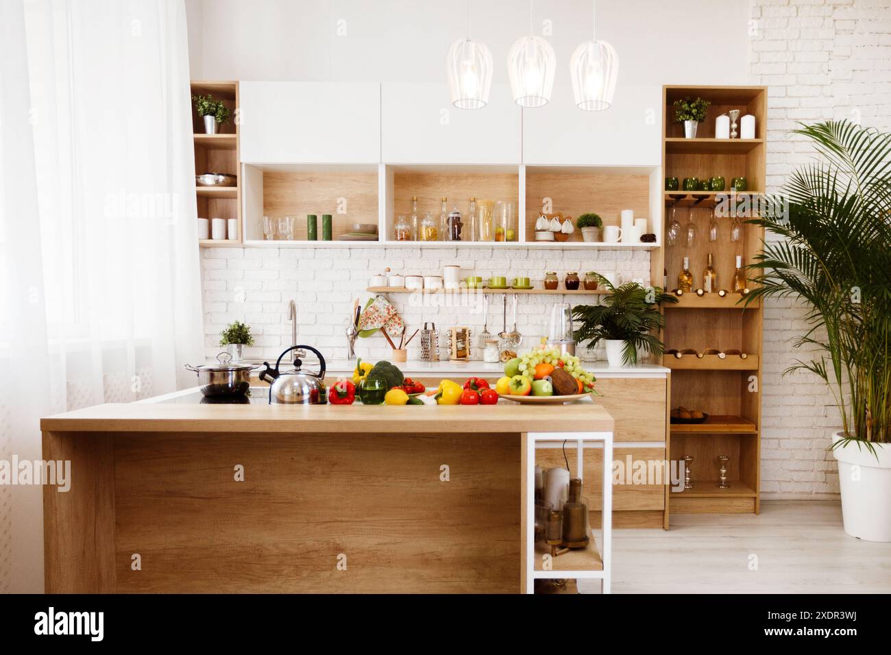 Modern Kitchen Island With Fresh Produce Stock Photo - Alamy
