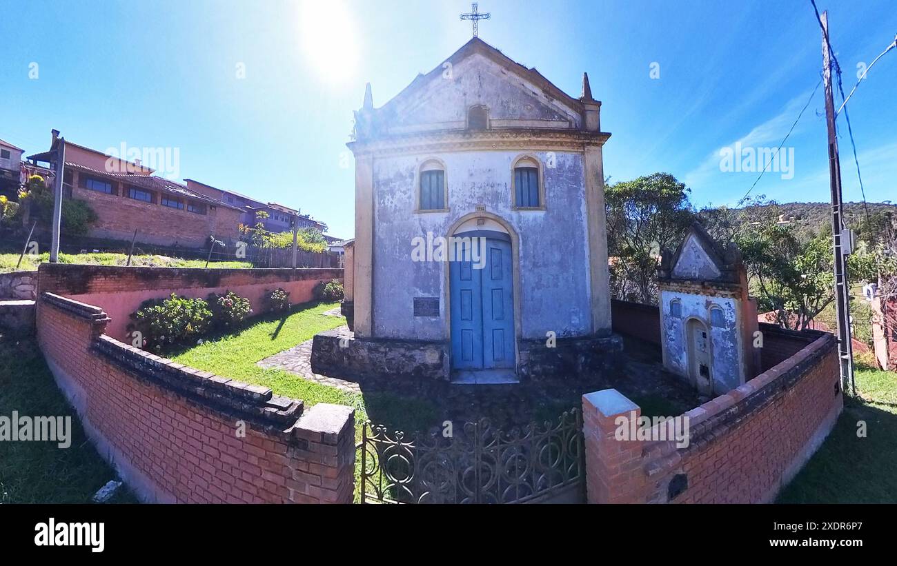 A scenic view of Nossa Senhora do Rosario de Ibitipoca under a blue sky ...