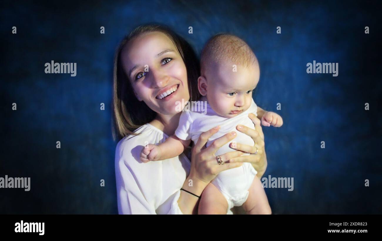 Happy mother kissing hugging newborn hi-res stock photography and images - Alamy