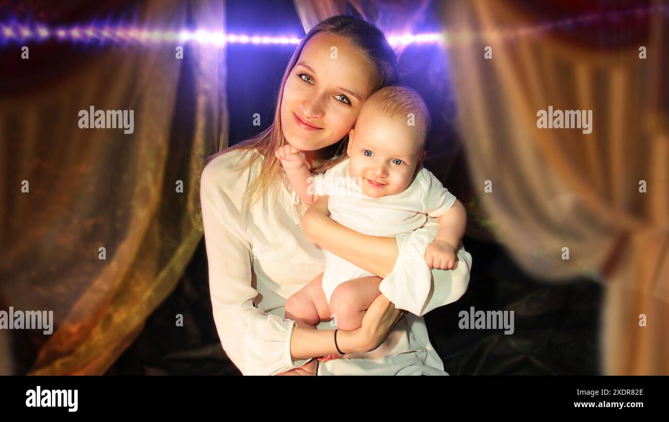 Mother holding her son in her arms Stock Photo - Alamy