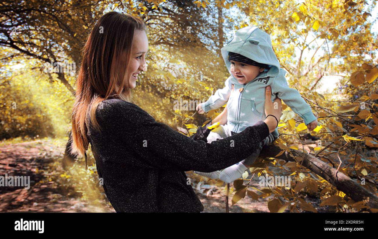 Mother holding her son in her arms Stock Photo - Alamy