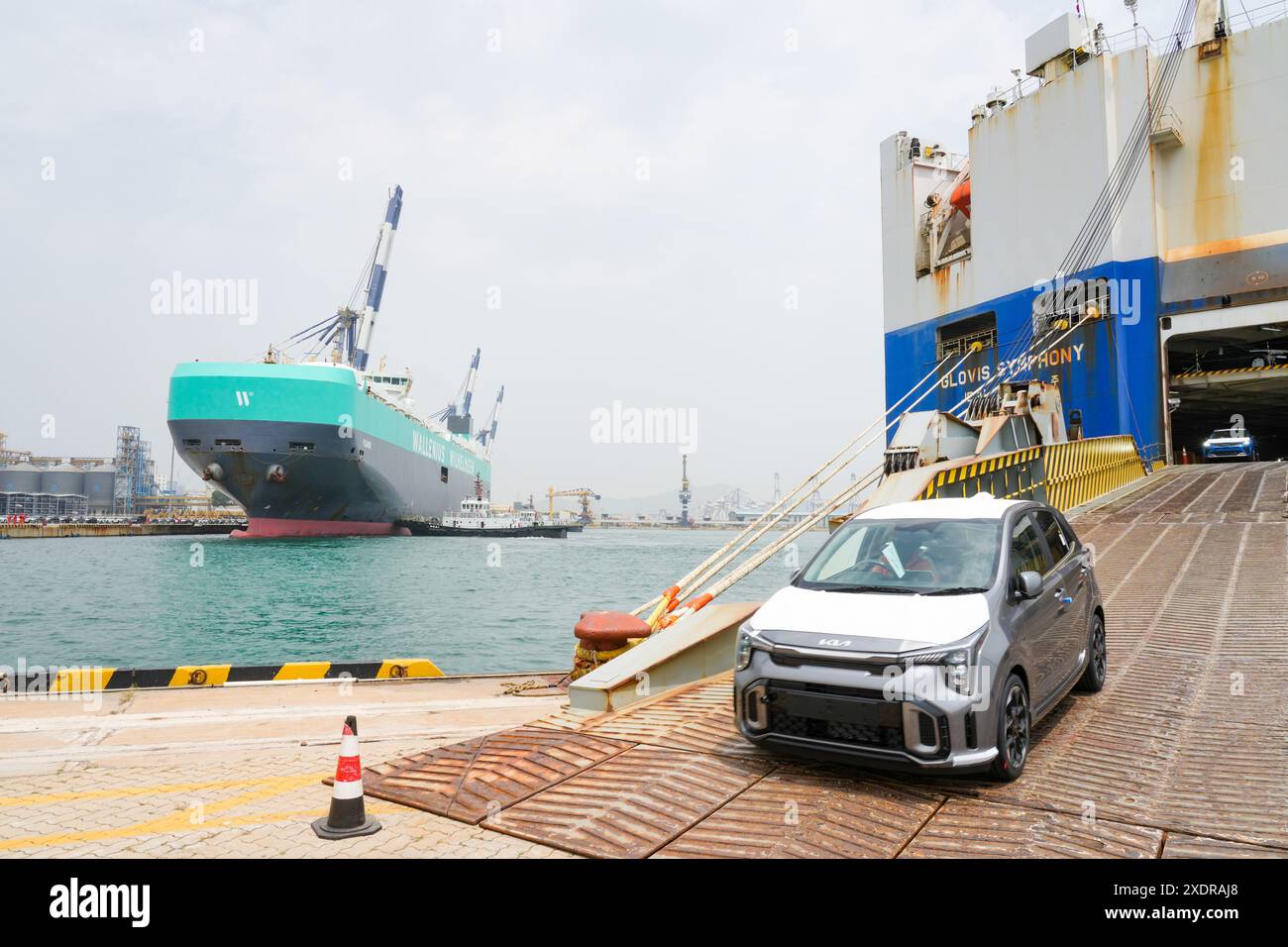 Yantai. 23rd June, 2024. A vehicle drives off from a ro-ro ship to the ...