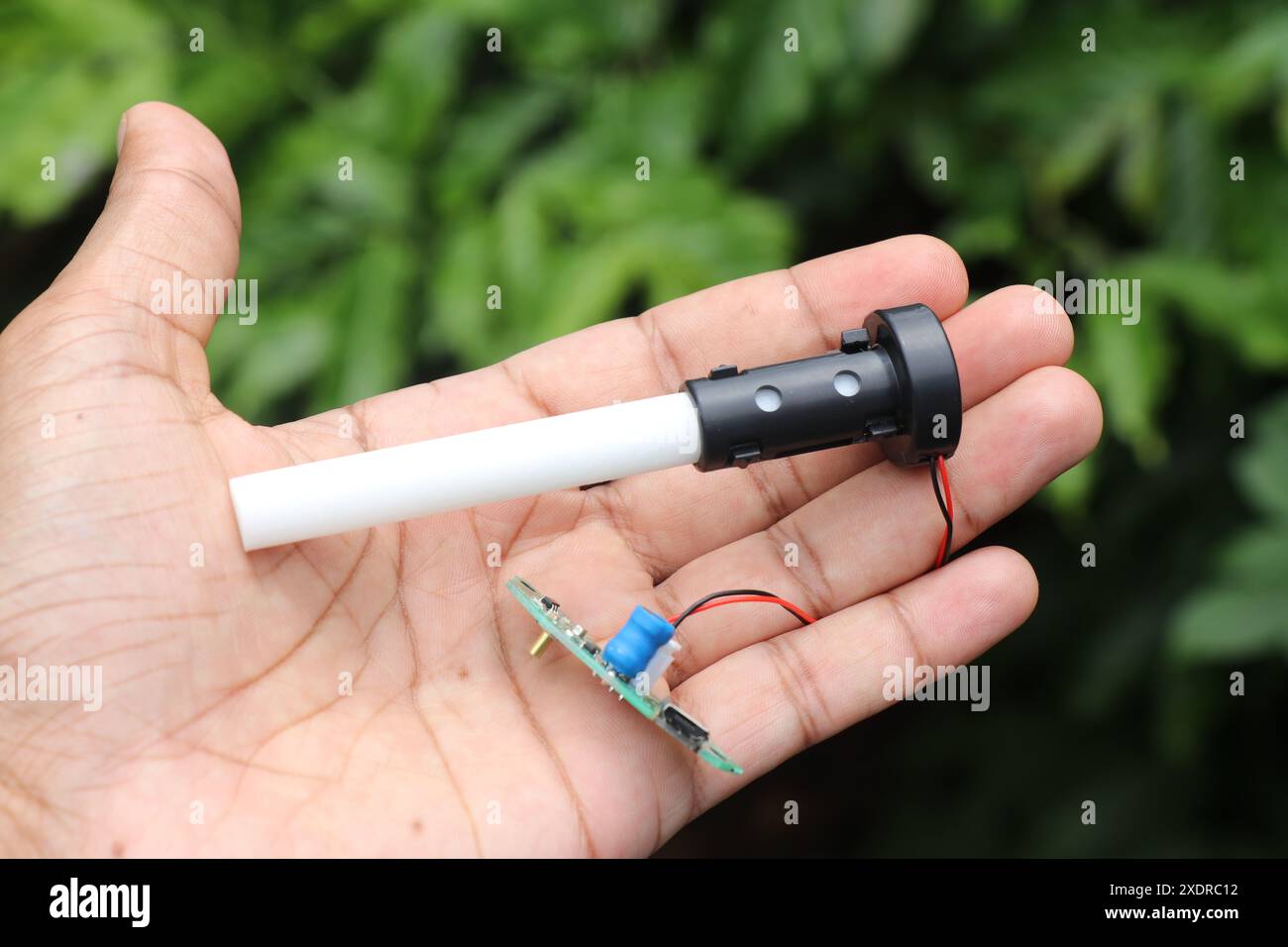 Humidifier spray module held in the hand isolated on natural background ...