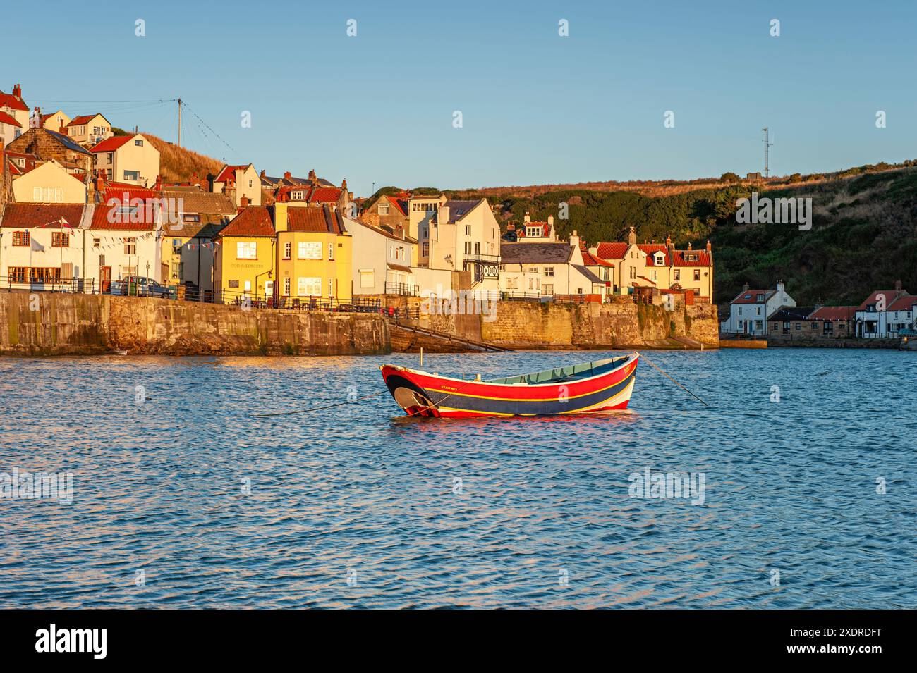 Fishing Cobbles in Staithes Harbour Stock Photo - Alamy