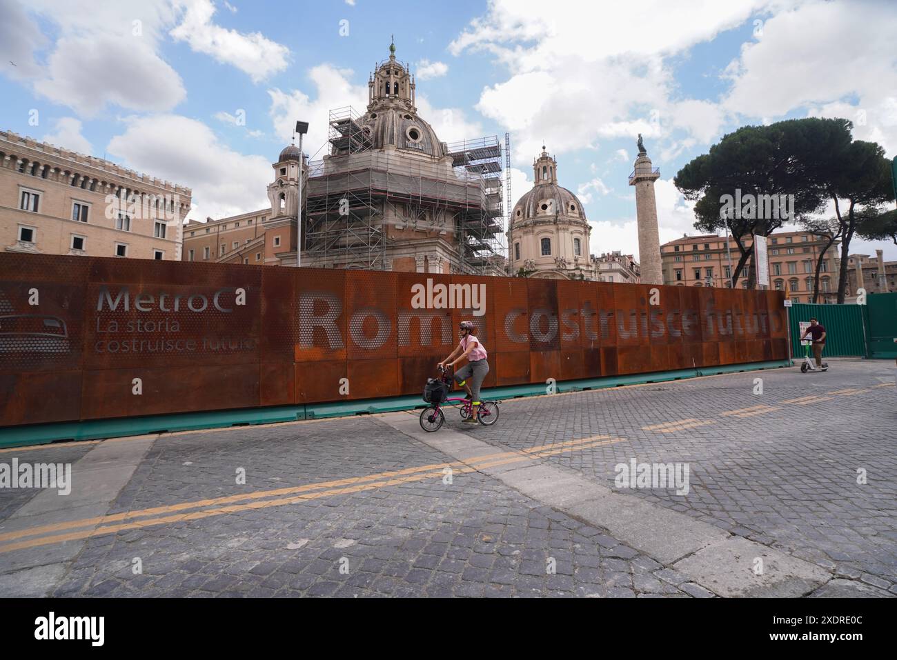 Rome, Italy. 24 June.2024. Scooters riders past the construction site ...