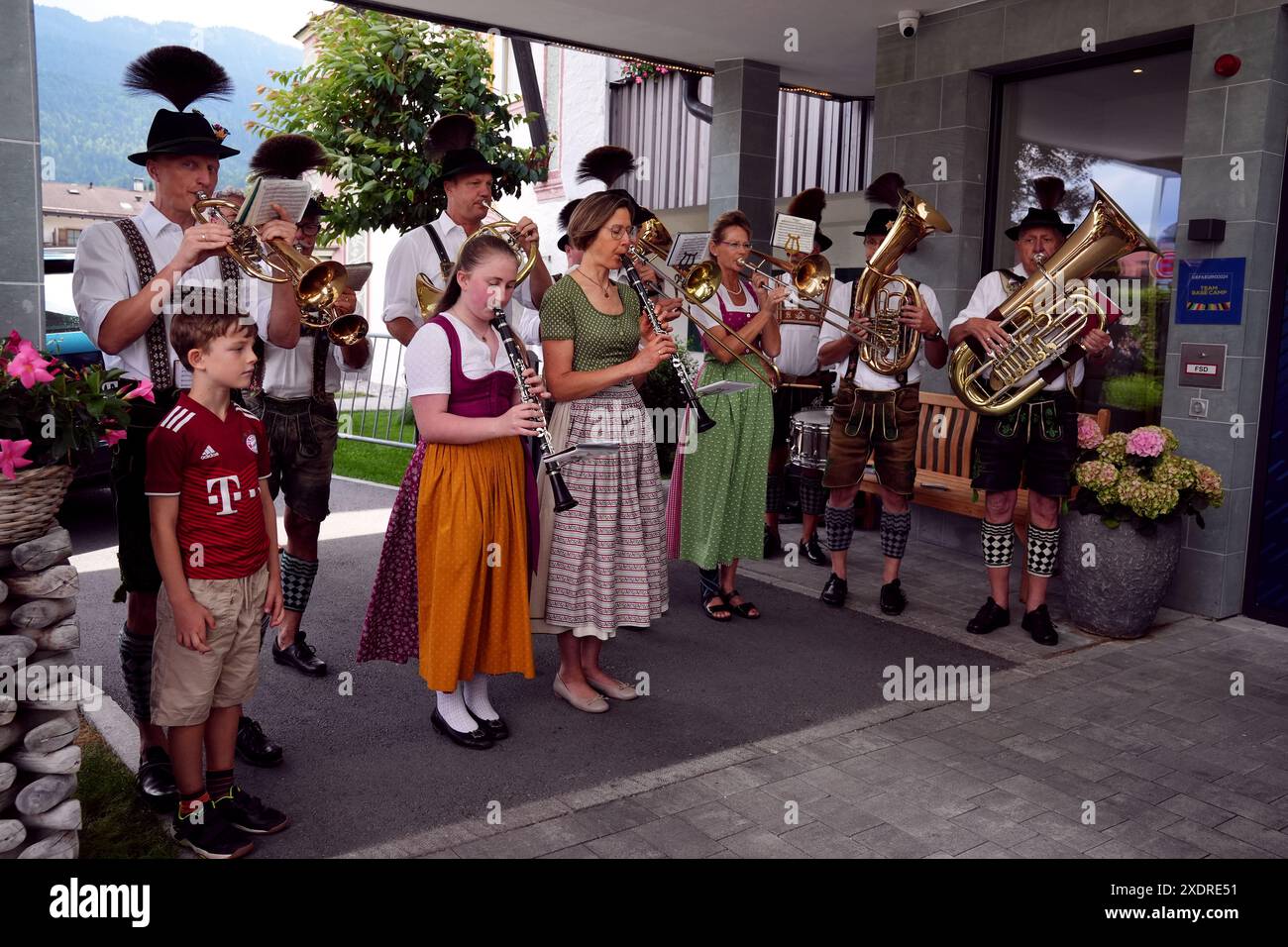 A local band play as the Scotland team depart their base camp in ...