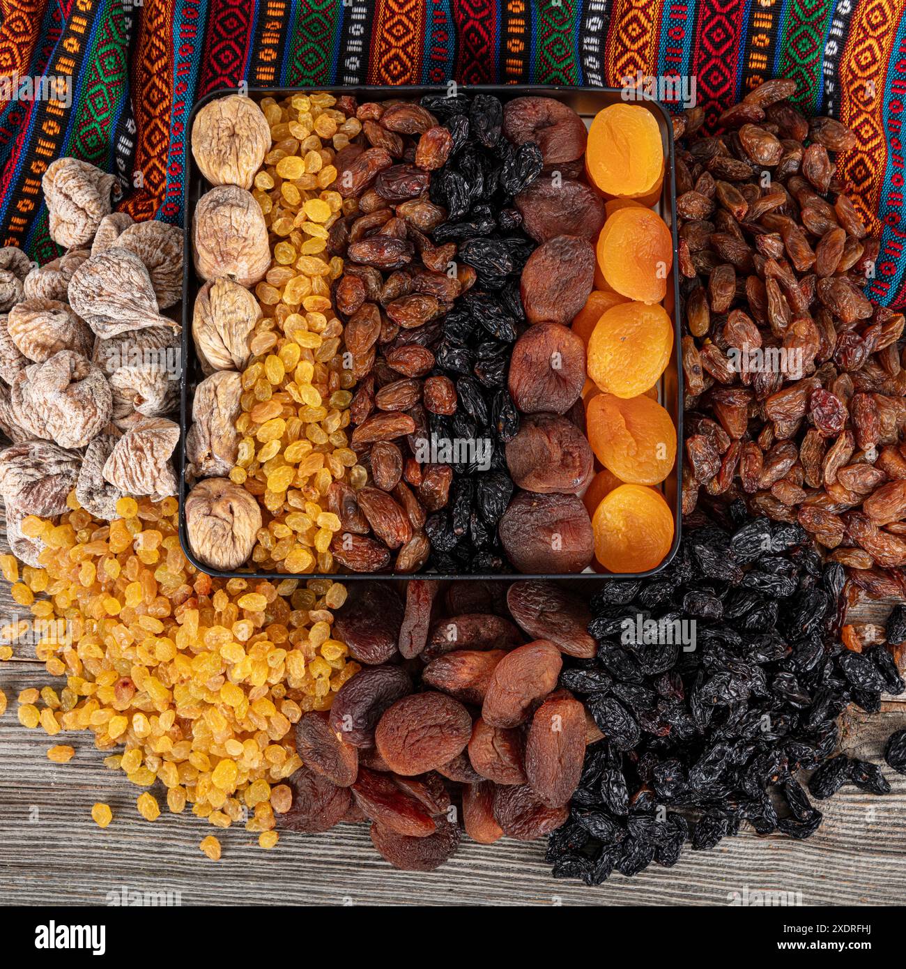 Types of dried fruits. Dried apricots, black and light raisins and ...