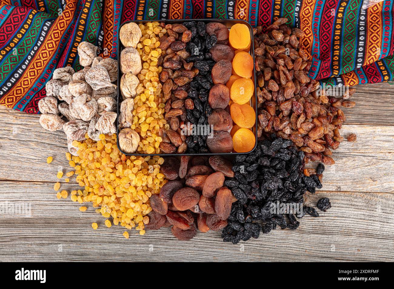 Types of dried fruits. Dried apricots, black and light raisins and ...