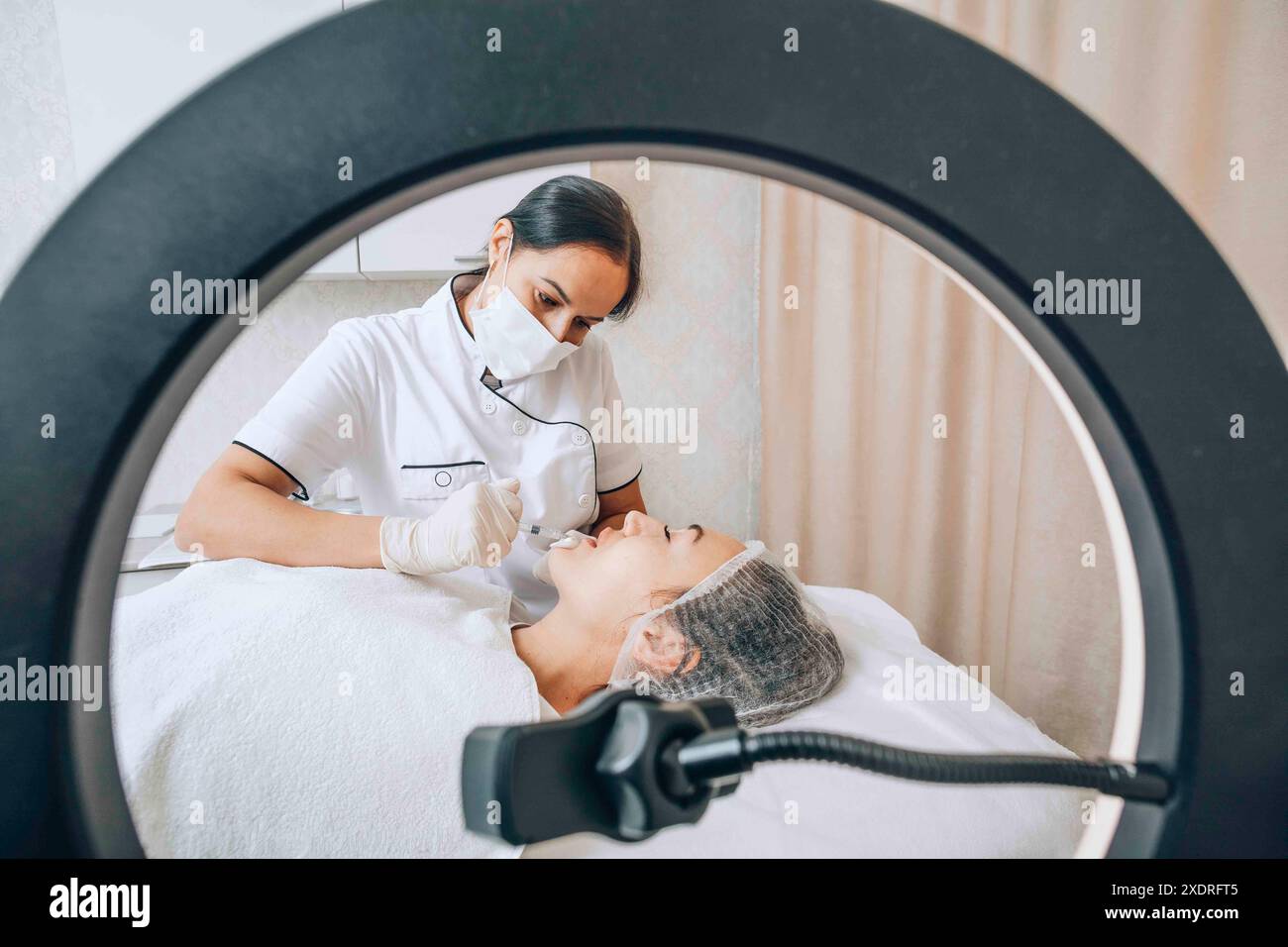 skilled medical professional performing delicate facial treatment using ...