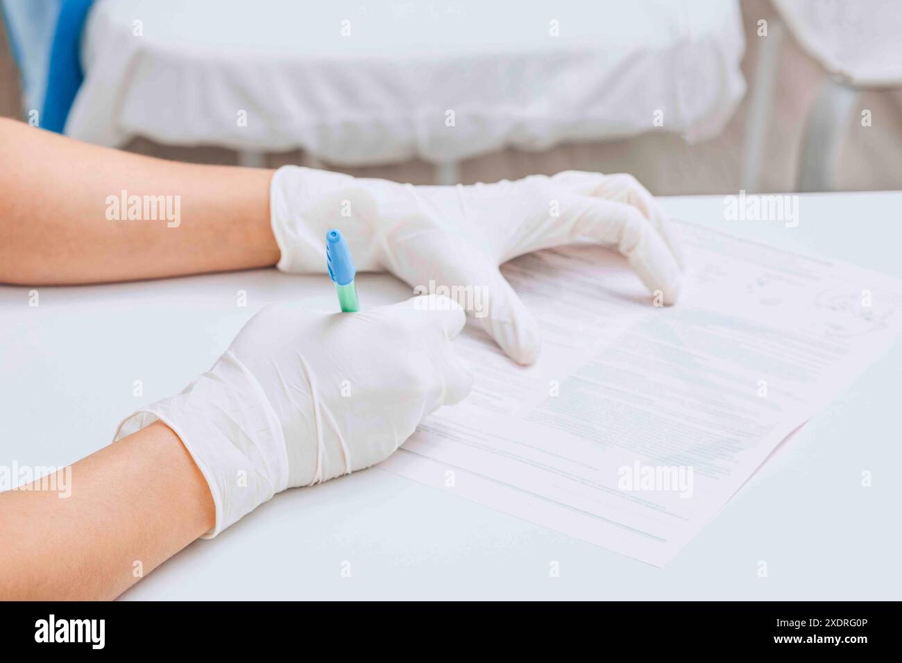 healthcare professional carefully filling out paperwork underscores ...